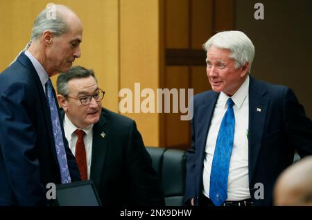 Claud "Tex" McIver, left, speaks with his defense attorney Amanda Clark ...