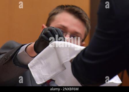 Zachary Weitzel, a GBI firearms examiner responsible for the forensic ...