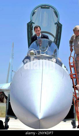 In this photo released by the official Facebook page of the Syrian ...