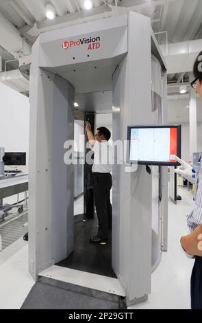 A “full-body scanner” is shown to media on at Terminal 2 of Kansai ...