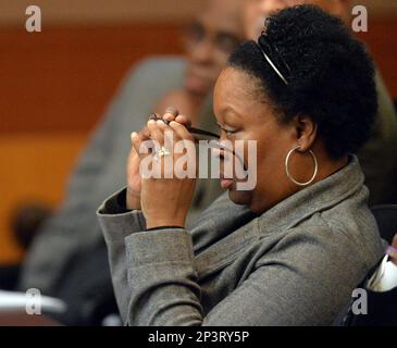 Former APS Dunbar Elementary teacher Shani Robinson listens as Kathleen ...