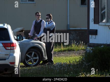 Royal Canadian Mounted Police investigators work at the home of ...