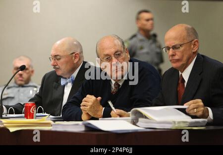Former Tampa Police captain Curtis Reeves, Jr., center, listens to ...