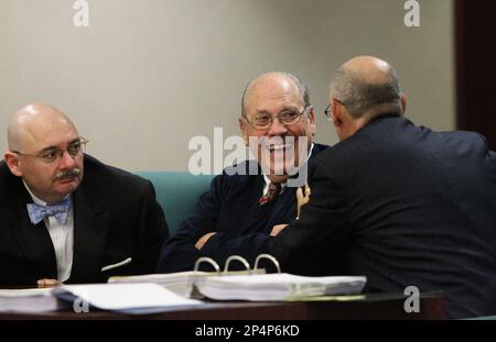 Former Tampa Police captain Curtis Reeves, Jr., center, listens to ...