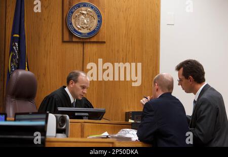 Judge Derek Pullan confers with Utah County Prosecutor Chad Grunader ...