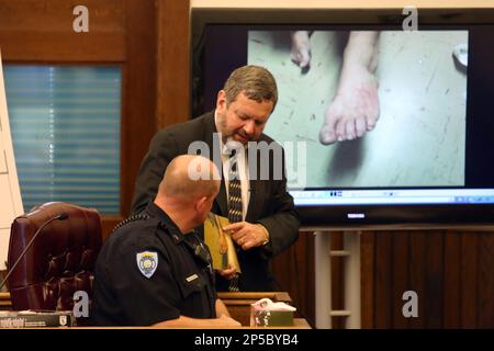 Defense attorney Roger Falk questions Brett Seacat about the ...