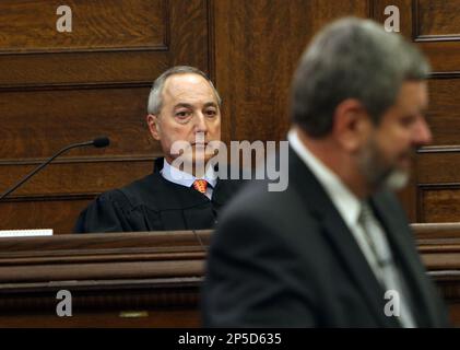 Defense attorney Roger Falk questions Brett Seacat about the ...