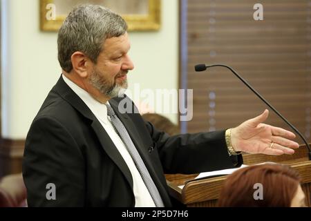 Defense attorney Roger Falk questions Brett Seacat about the ...