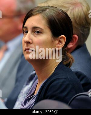 Hemy Neuman listens as Andrea Sneiderman testifies during day one of ...