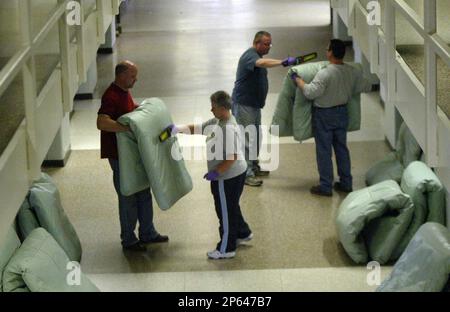 From left, Muskegon Correctional Facility corrections officers Paul ...