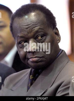 Onyango Obama, the uncle of President Barack Obama, right, stands with ...