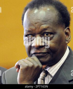 Onyango Obama, the uncle of President Barack Obama, right, stands with ...
