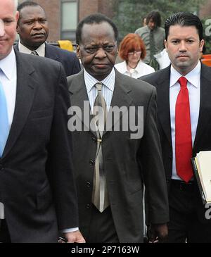 Onyango Obama, the uncle of President Barack Obama, right, stands with ...