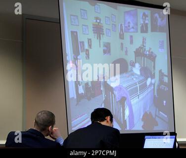 Steven Spader, left, and attorney Andrew Winters look at an evidence ...