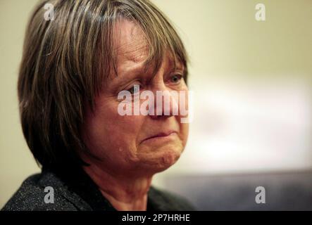 Joyce Young, mother of Jocelyn Earnest, cries after looking at a ...