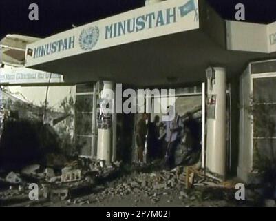 This still made from video provided by UNTV shows peacekeepers carrying ...