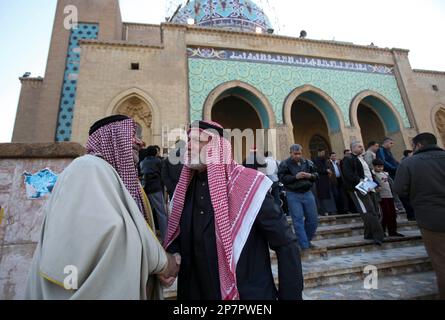 Iraqi Muslims exchange greetings after Eid prayers outside the 14th ...