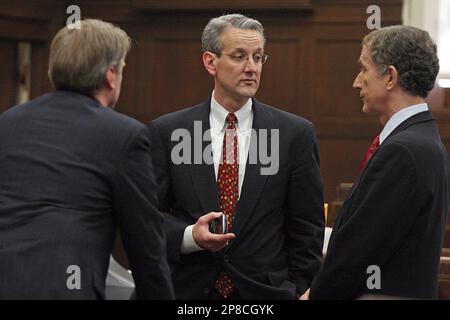 Defense Attorney Timothy Bradl, center standing, speaks on behalf of ...