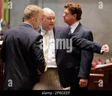 Rep. Jason Mumpower, R-Bristol, center, talks with reporters after the ...