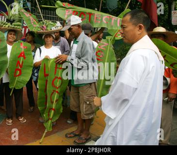 Filipino priest Father Robert Reyes gestures during a press conference ...