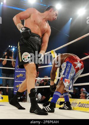 Ukraine's boxer Vitali Klitschko, left, punches Cuba's boxer Juan ...