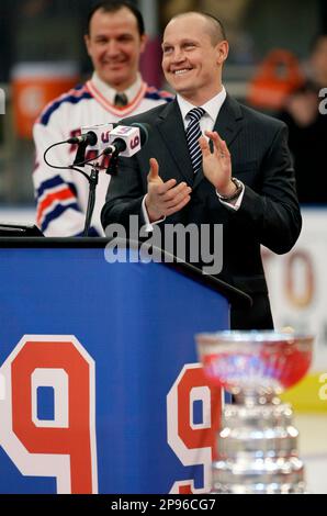 Former New York Rangers' Adam Graves, left, shed tears with his son ...