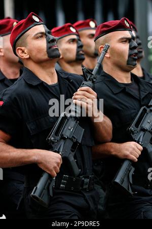 Lebanese soldiers from the special forces unit march in frontof the ...