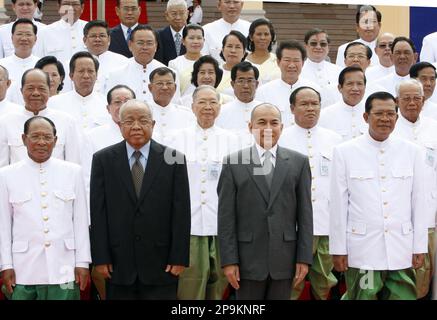Cambodia's King Norodom Sihamoni, second left, accompanied by his ...
