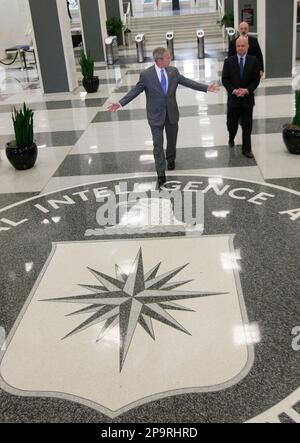 President Bush walks with CIA Director Michael Hayden, right, and ...