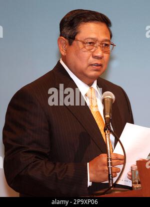 Indonesian President Susilo Bambang Yudhoyono, left, is greeted by ...