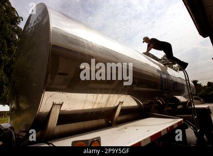 Tillamook Dairy milk truck driver Jim Stewart prepares to unload milk ...