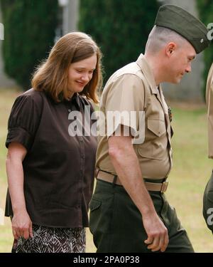 Marine Corps Lt. Col. Jeffrey Chessani, left, arrives with his wife ...