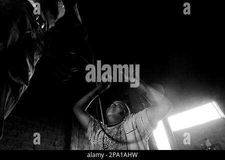 Palestinian mechanics, Ahmed Samarah, 14, center, and Mohammed ...