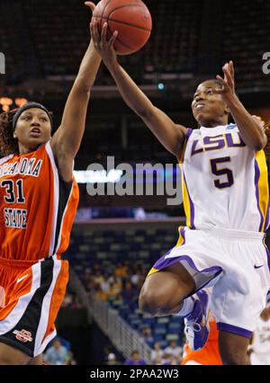 LSU guard Erica White (5) goes up for a shot past Jackson State forward ...
