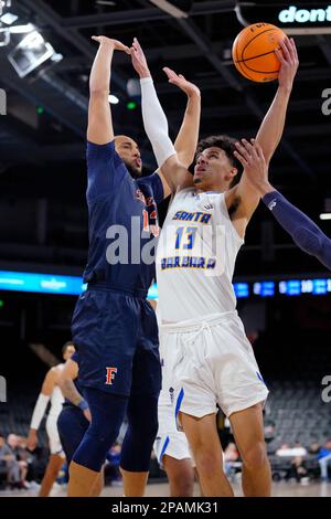 UC Santa Barbara guard Ajay Mitchell (13) shoots against Cal State ...