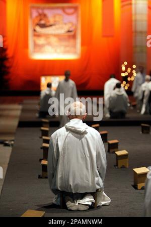 Brothers of the ecumenical community Taize wait before the start of a ...