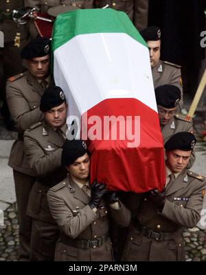 An Italian flag wraps the coffin of Daniele Paladini, the Italian ...