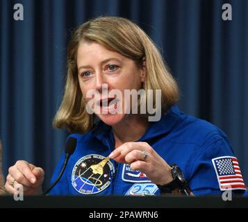 Space shuttle Discovery Commander Pamela Melroy, left, introduces her ...