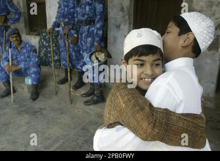 Muslims greet each other after prayers on the first day of Eid al-Fitr ...