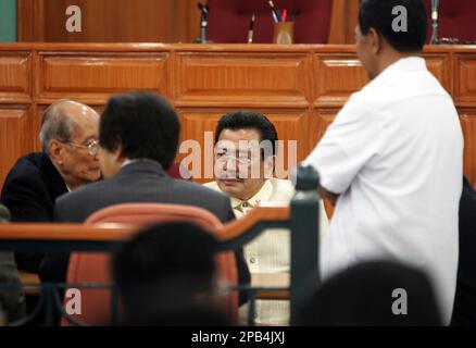 Philippine Senator Jinggoy Estrada, center, the son and co-accused of ousted President Joseph ...