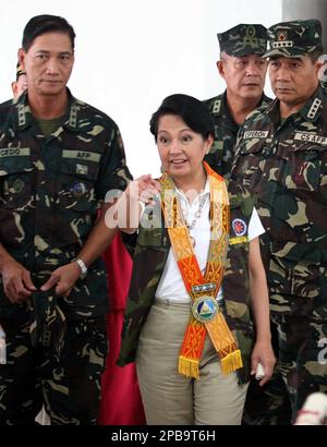 Western Mindanao Command chief Lt. Gen. Eugenio Cedo, center, presents ...