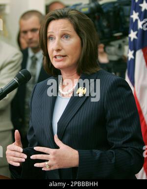U.S. Attorney Mary Beth Buchanan, center, explains that federal ...