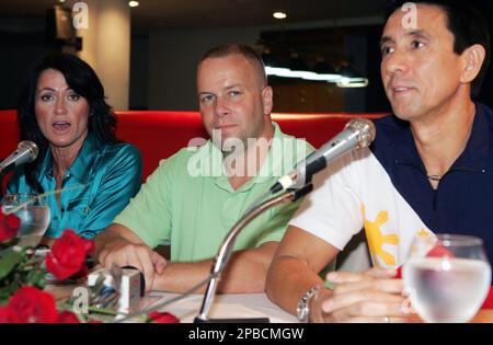 Former Romanian Olympics Gymnastics champion Nadia Comaneci, center ...