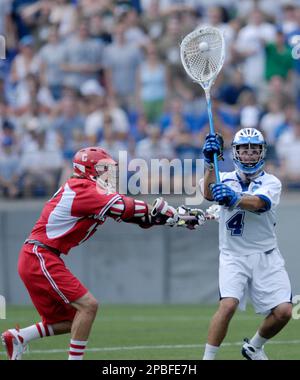 Duke lacrosse goalie Dan Loftus tosses the ball during practice in ...