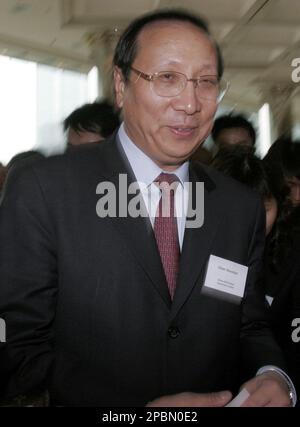 Chen Xiaoxian, President of China CITIC Bank, right, leaves a hotel ...