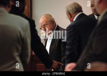 David Edenfield, center, enters the courtroom for his arraignment in ...