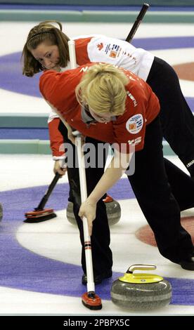 Canada's skip Kelly Scott at right reacts near her teammates and coach ...