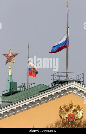 A Russian flag, right, and President's colour at half-staff above the ...