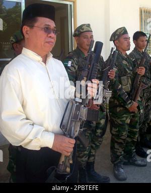 Moro Islamic Liberation Front chairman Al Haj Murad gestures as he ...
