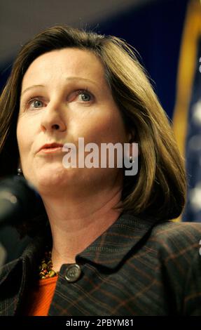 U.S. Attorney Mary Beth Buchanan, center, explains that federal ...